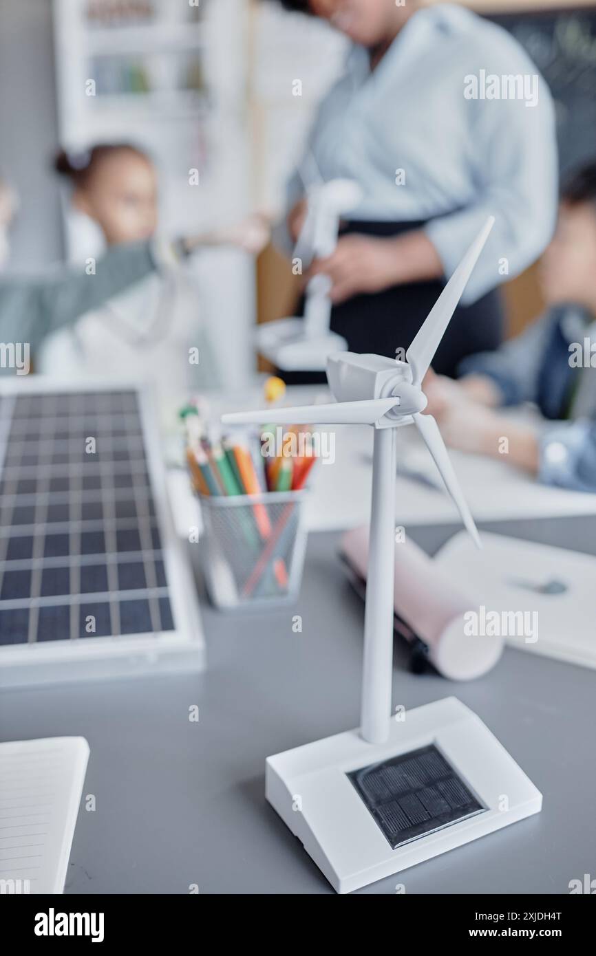 Vertical close up on small wind turbine model powered by solar energy ...