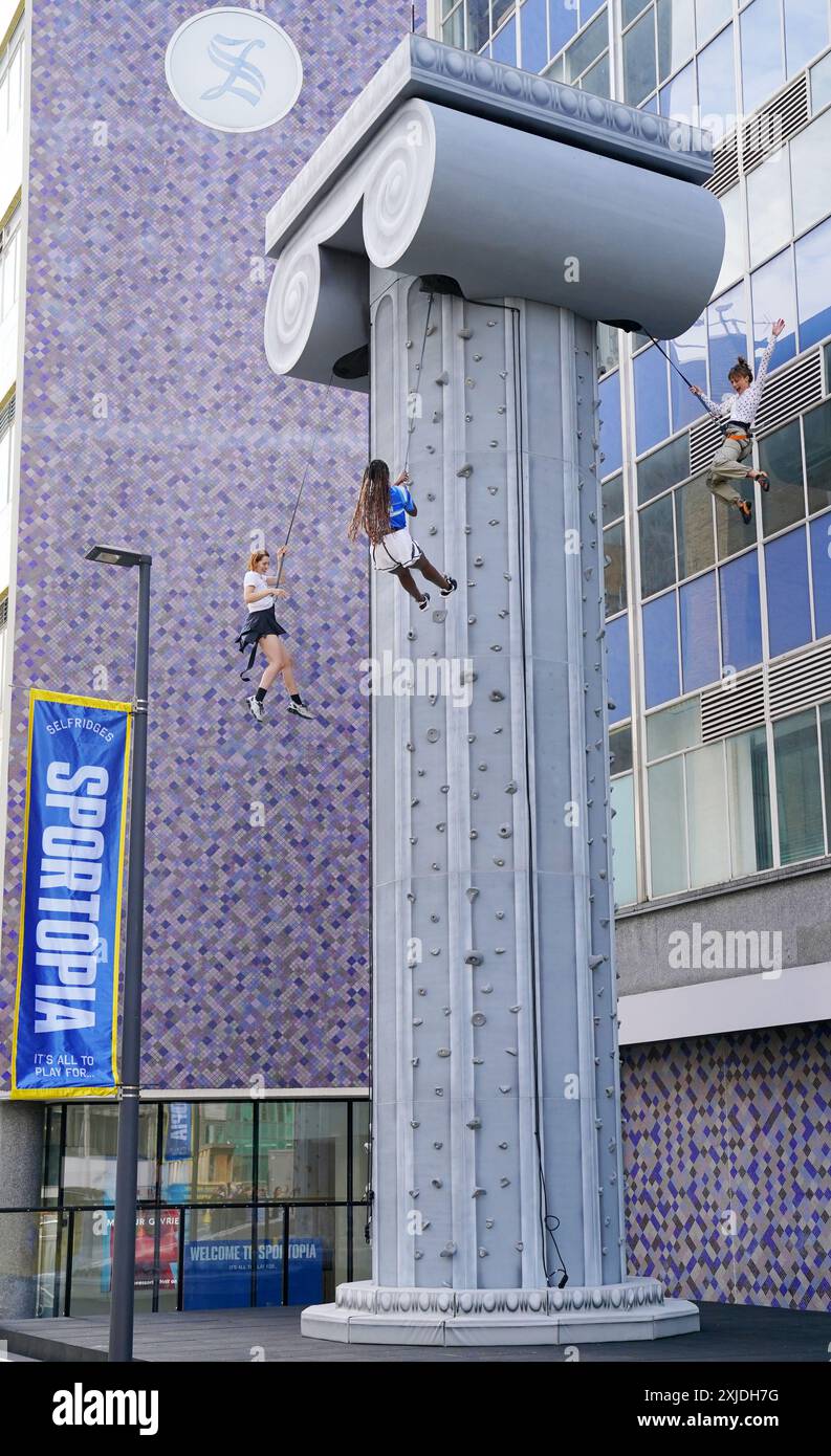 Members of the Gorp Girls climb a custom-built 10-metre climbing column ...