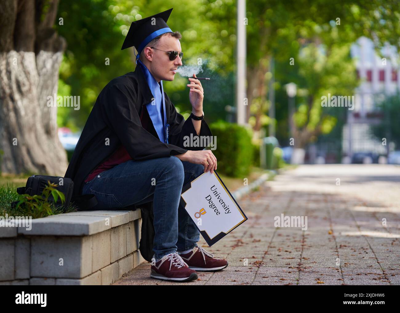 Young people in academic regalia hi-res stock photography and images ...