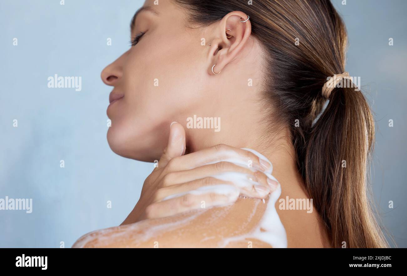 Woman, neck and hygiene with soap for shower, washing or skincare ...