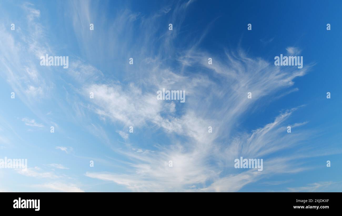 Timelapse. Cirrus clouds flying slowly on beautiful blue sky horizon ...