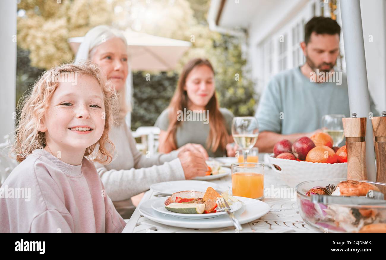 Kid, portrait and family with lunch outdoor for holiday celebration ...