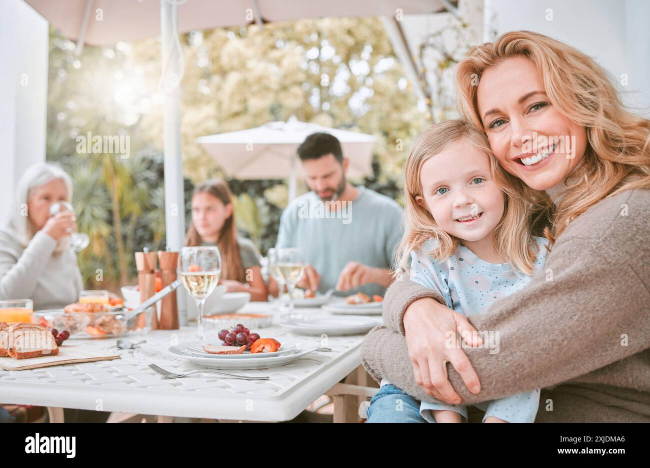Hug, woman and big family with happiness in backyard for celebration ...