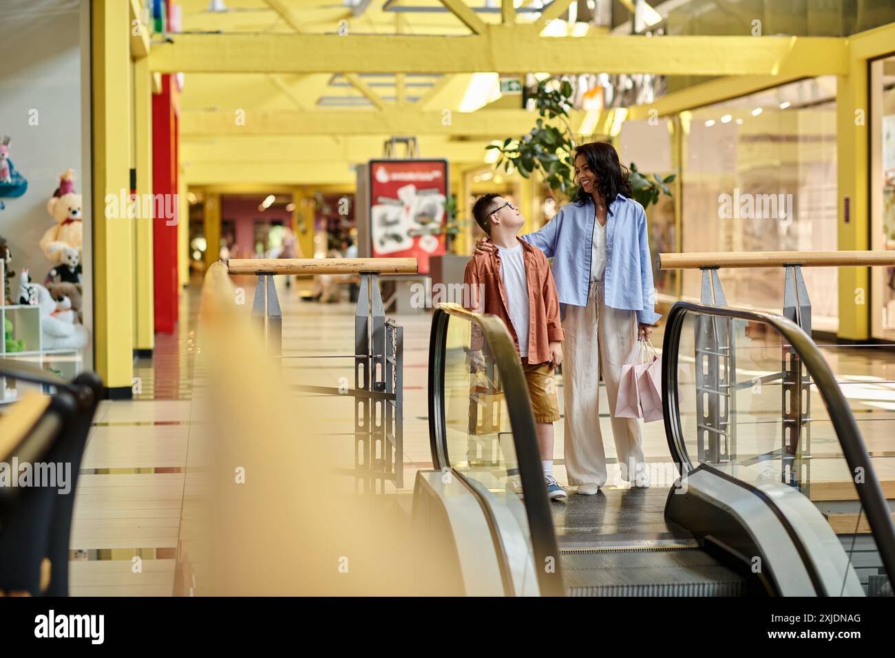A mother and her son with Down syndrome enjoy a day out at the mall ...