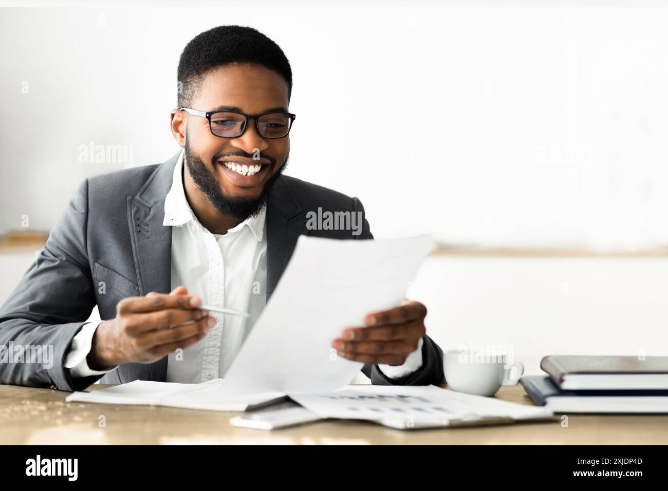 Black businessman reviewing documents hi-res stock photography and ...