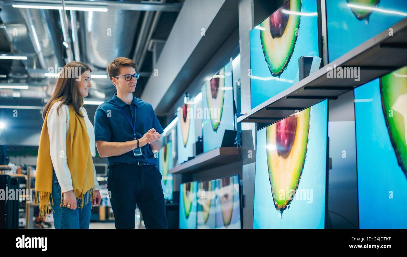 Portrait of a Female Talking with Retail Electronics Store Associate ...