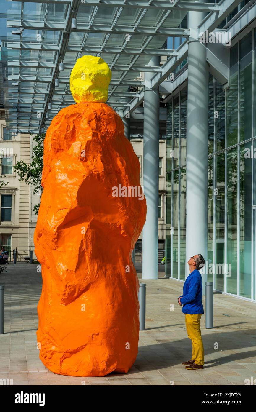 London, UK. 18th July, 2024. Ugo Rondinone's 5 metre orange yellow ...