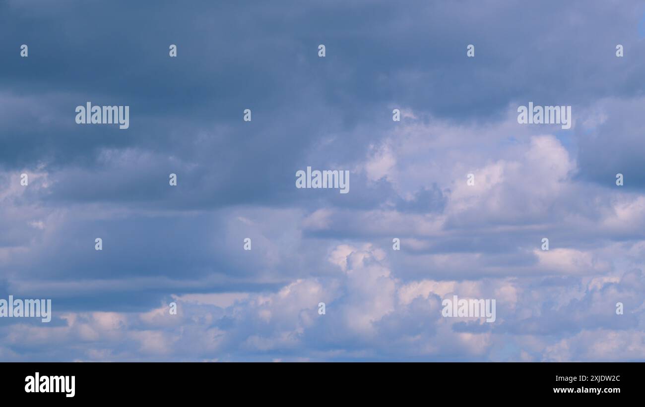 Time lapse. Fluffy layered clouds sky atmosphere. Majestic amazing blue ...