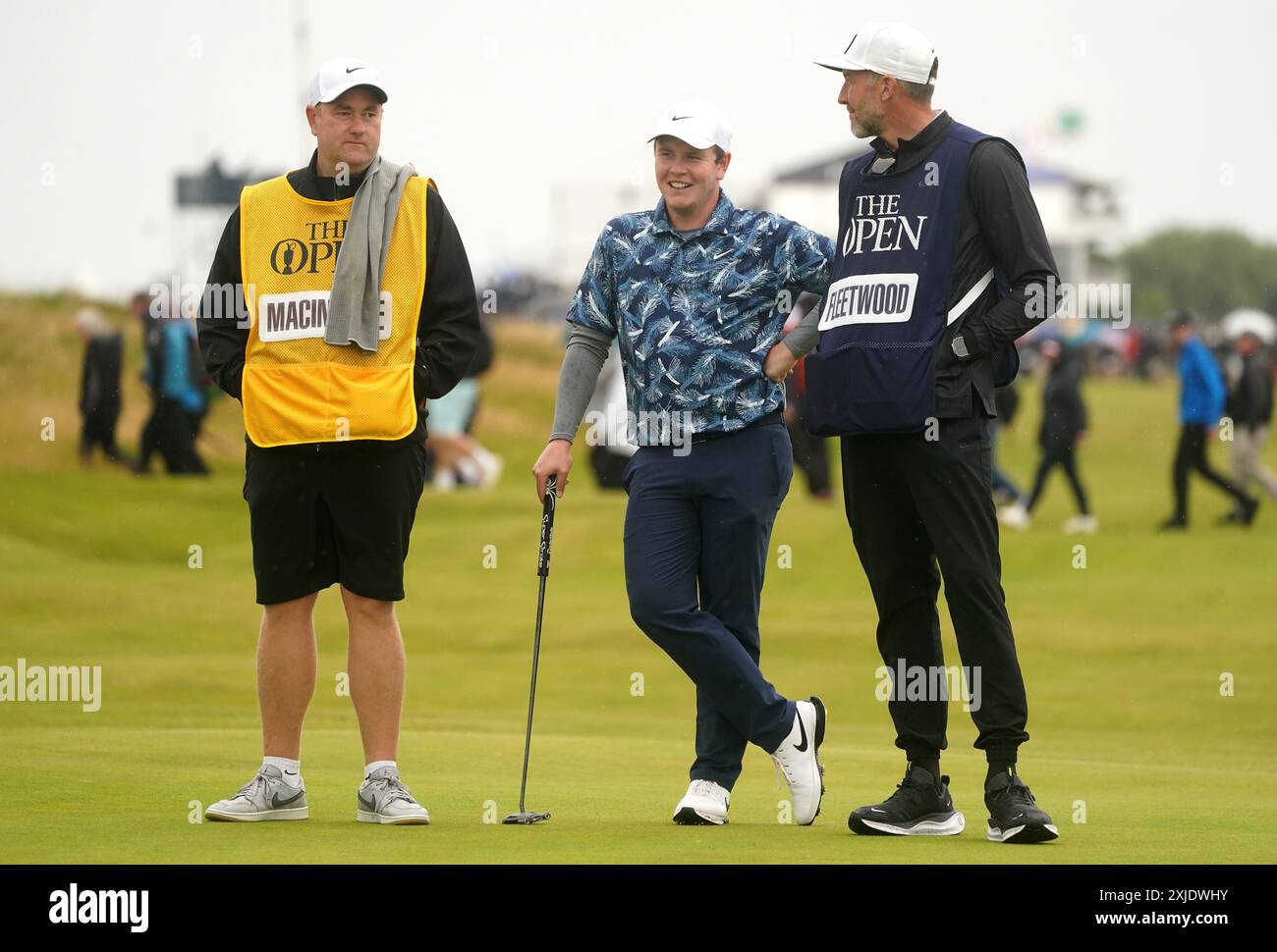 Scotland's Robert MacIntyre (centre) speaking with his caddy Mike ...