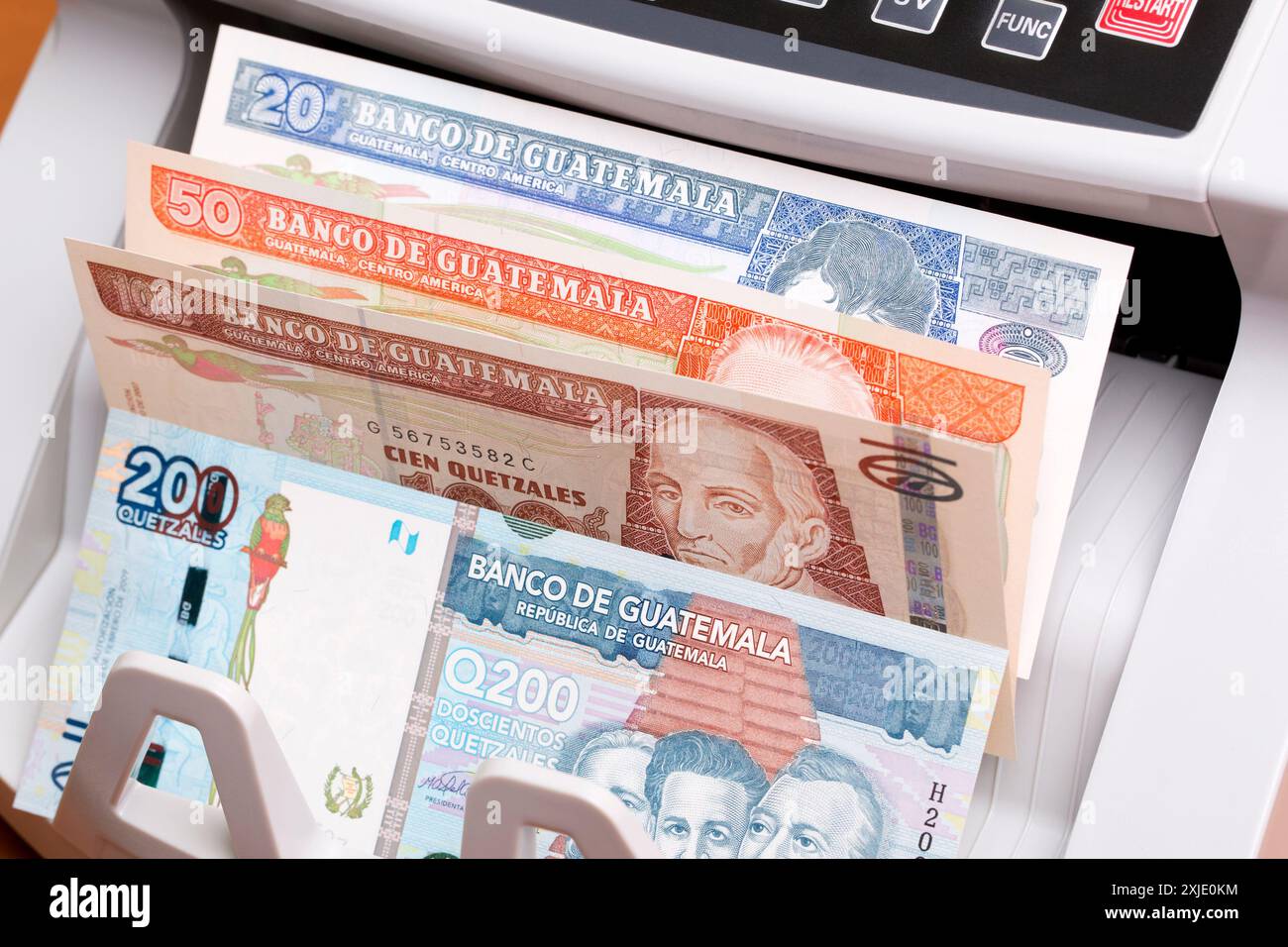 Guatemalan money - quetzal in the counting machine Stock Photo - Alamy