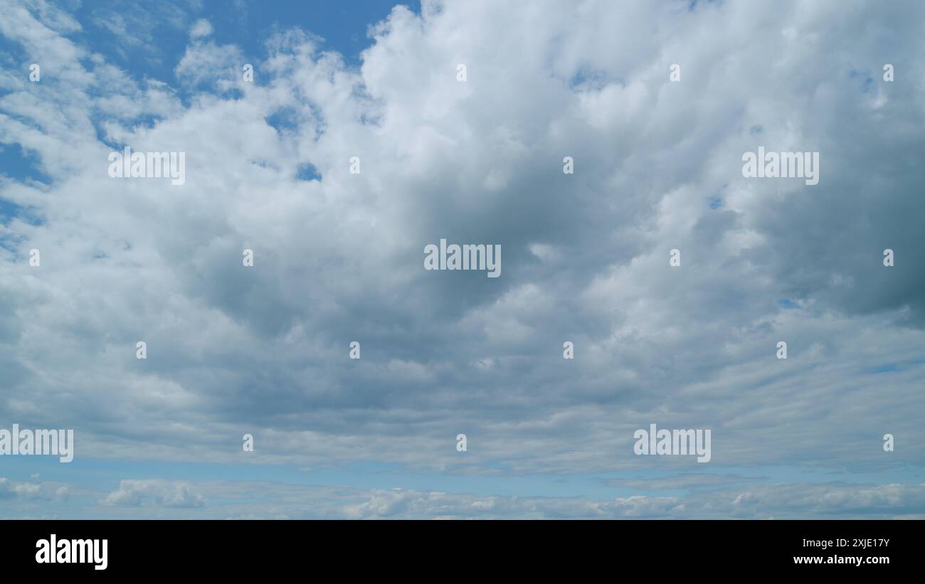 Time lapse. Blue sky white puffy fluffy clouds billow in high space. Sky with clouds weather ...