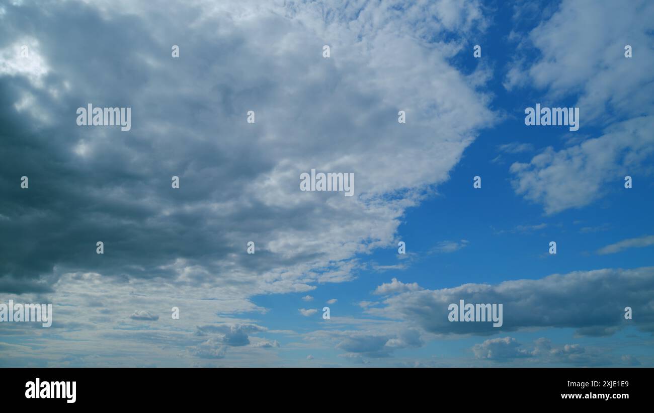 Time lapse. Blue sky with copyspace background with forming clouds in ...