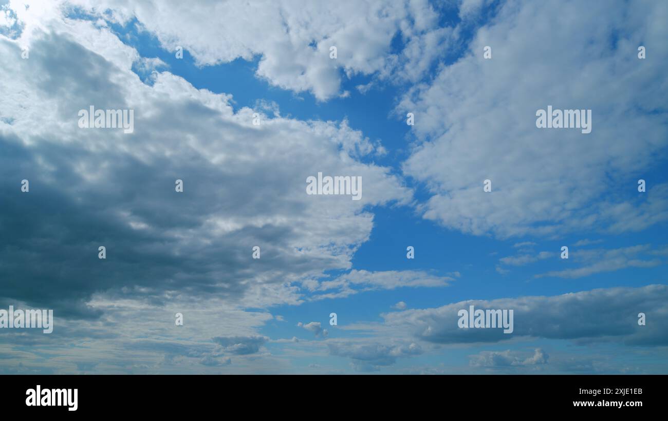 Time lapse. Blue sky white puffy fluffy clouds billow in high space. Sky with clouds weather ...