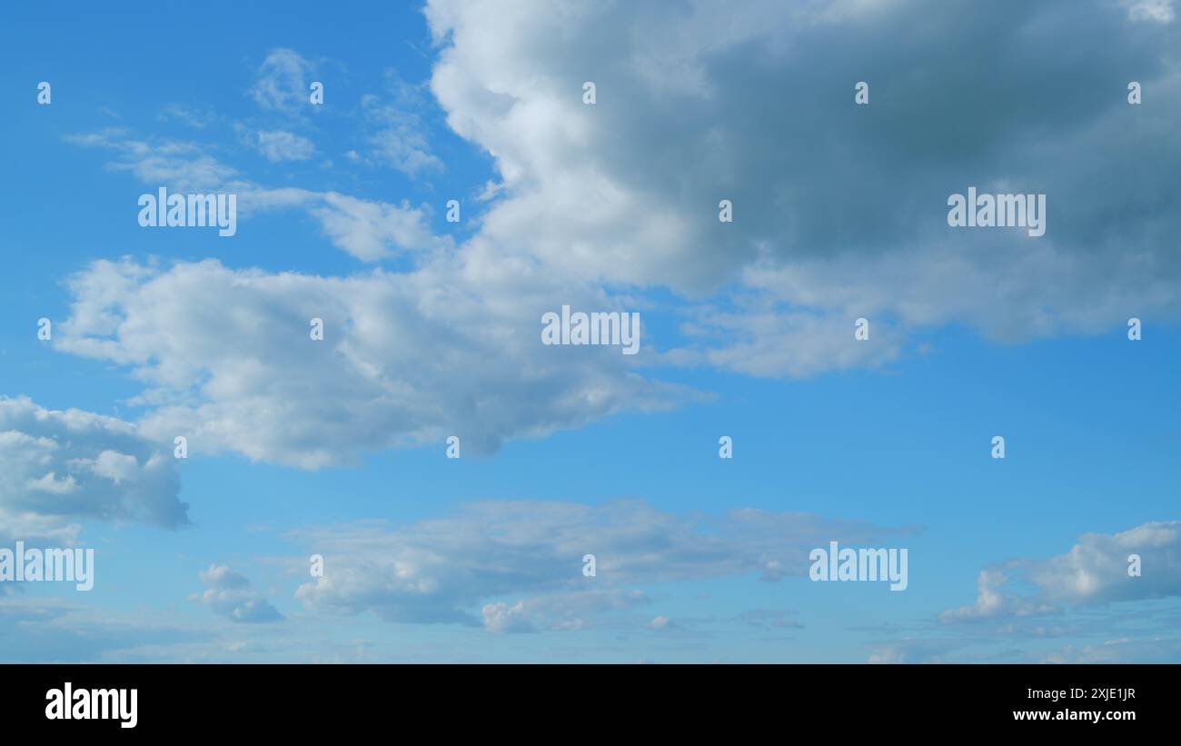 Time lapse. Blue heaven summer cloudscape. Rolling puffy white clouds ...