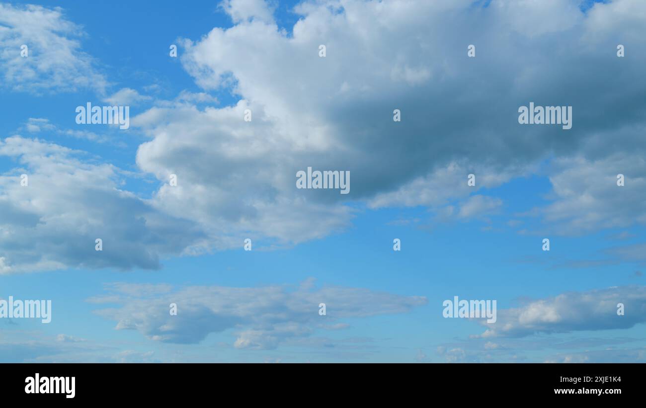 Time lapse. Cloud sky scape. Clouds flying and changing with different shapes on clear blue sky ...