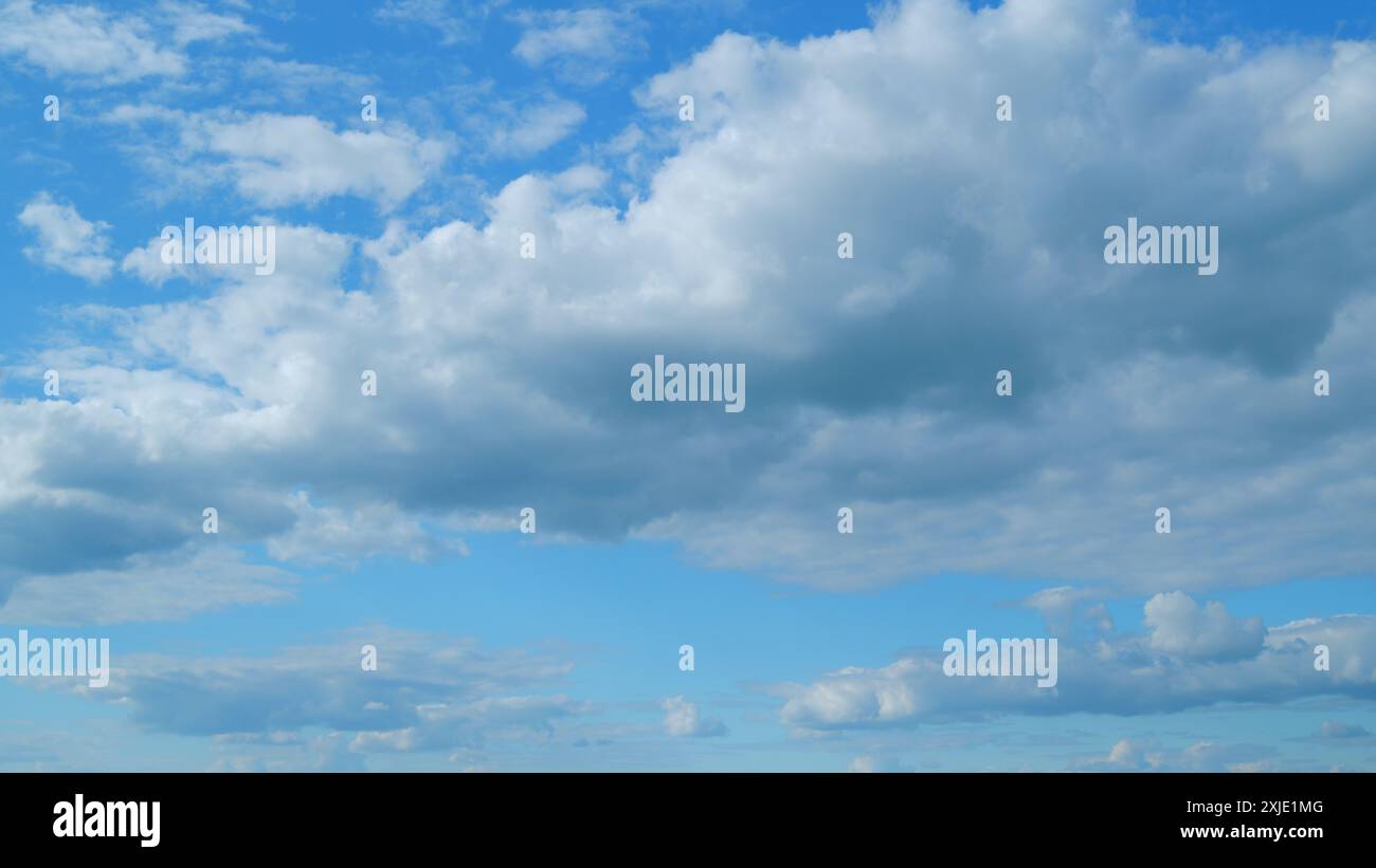 Time lapse. Blue sky white puffy fluffy clouds billow in high space. Sky with clouds weather ...