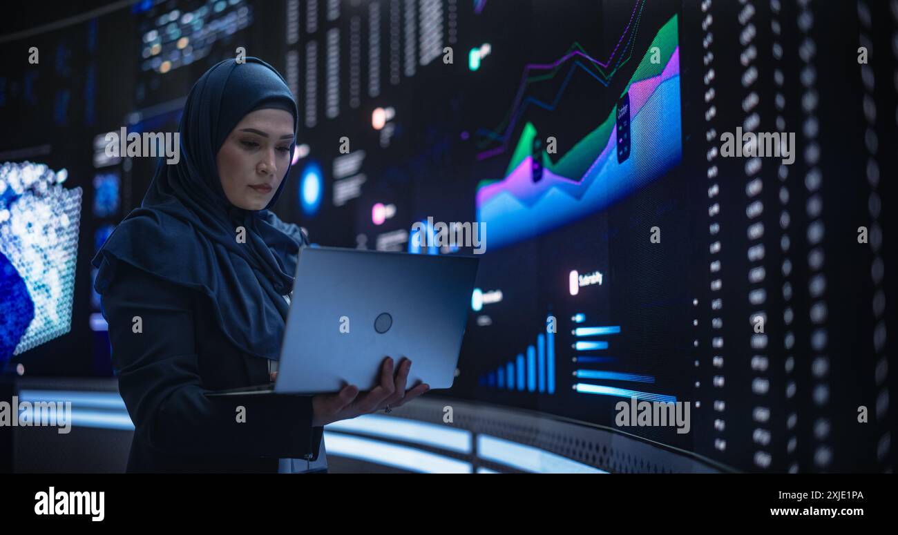 Muslim Female Data Center IT Engineer Standing in a Room with an AI ...
