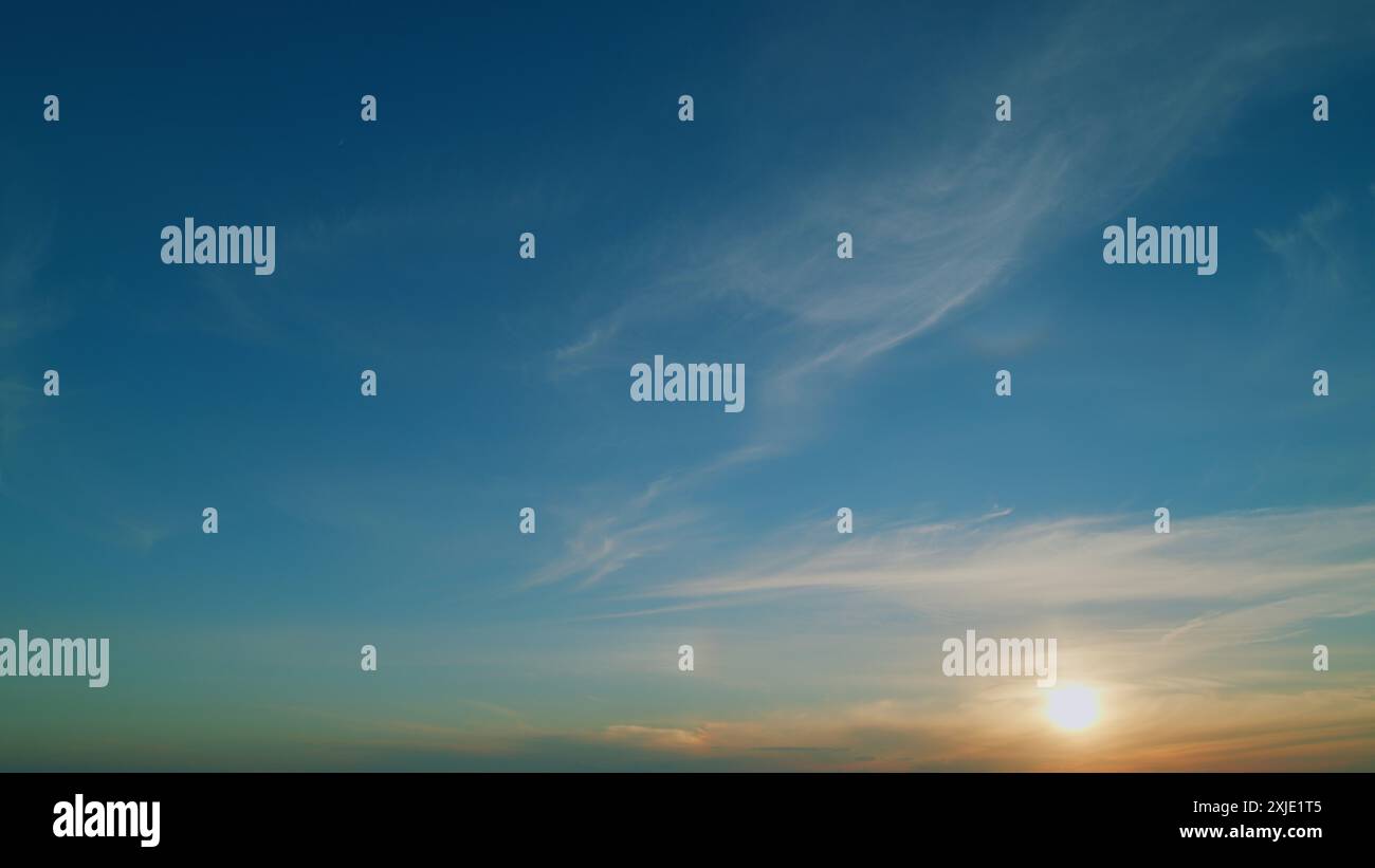 Time lapse. Rainbow sky clouds sunset with jet streams contrails ...