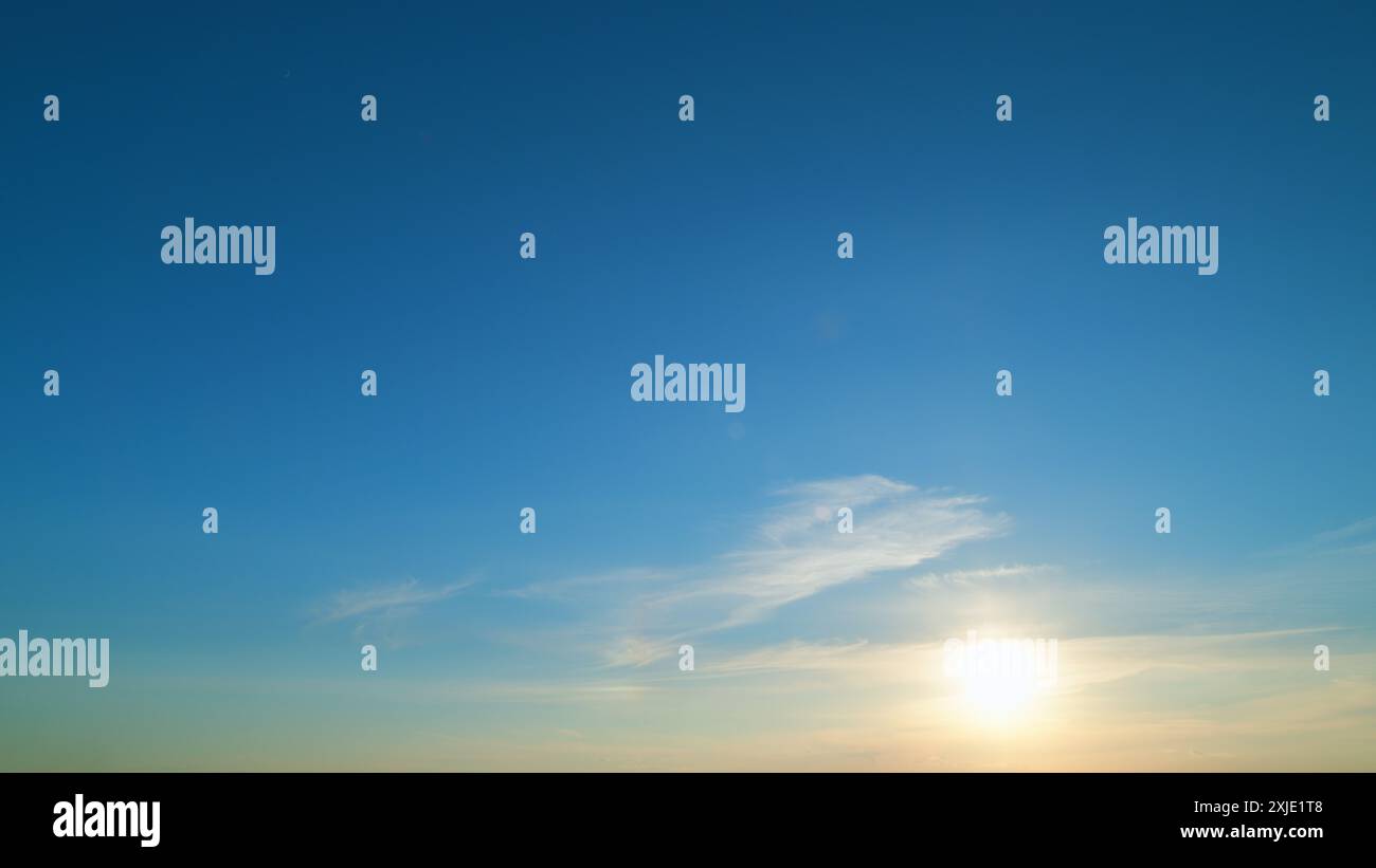 Time lapse. Clouds with orange and golden and light blue colors. Small ...