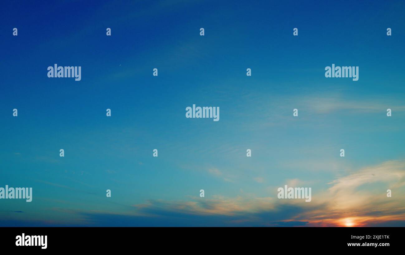 Time lapse. Sun halo. Colorful evening sunset sky with pastel red ...