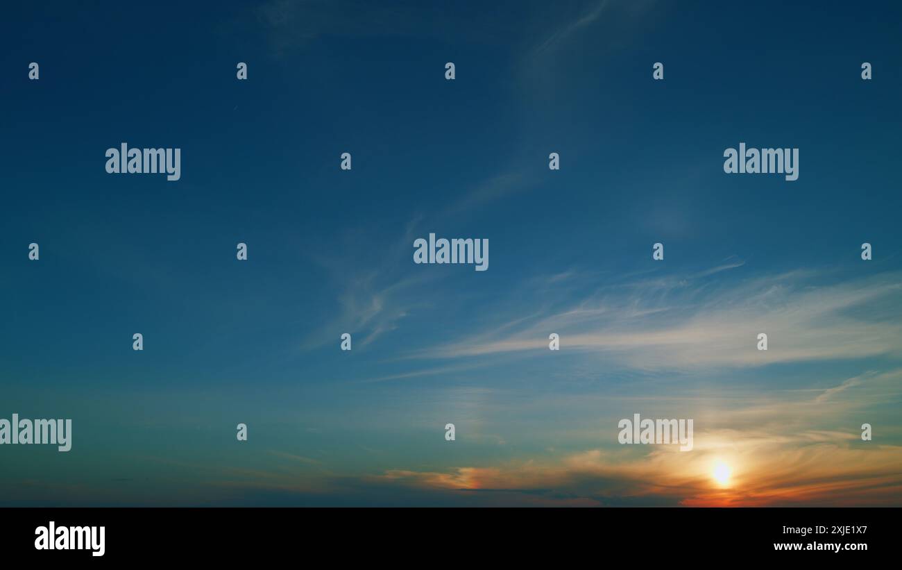 Time lapse. Crescent moon and red purple cloudscape background and dark ...