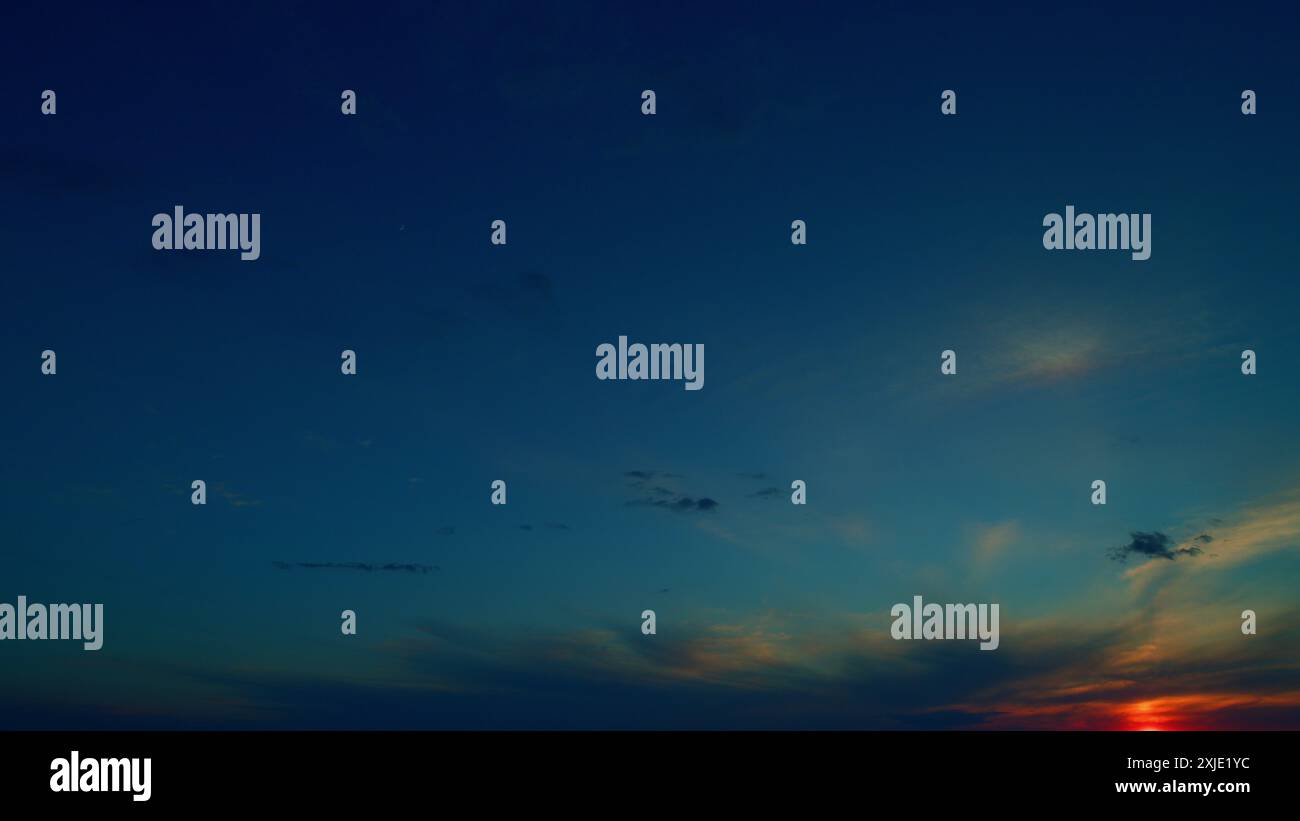 Time lapse. Sun halo. Colorful evening sunset sky with red purple pink ...