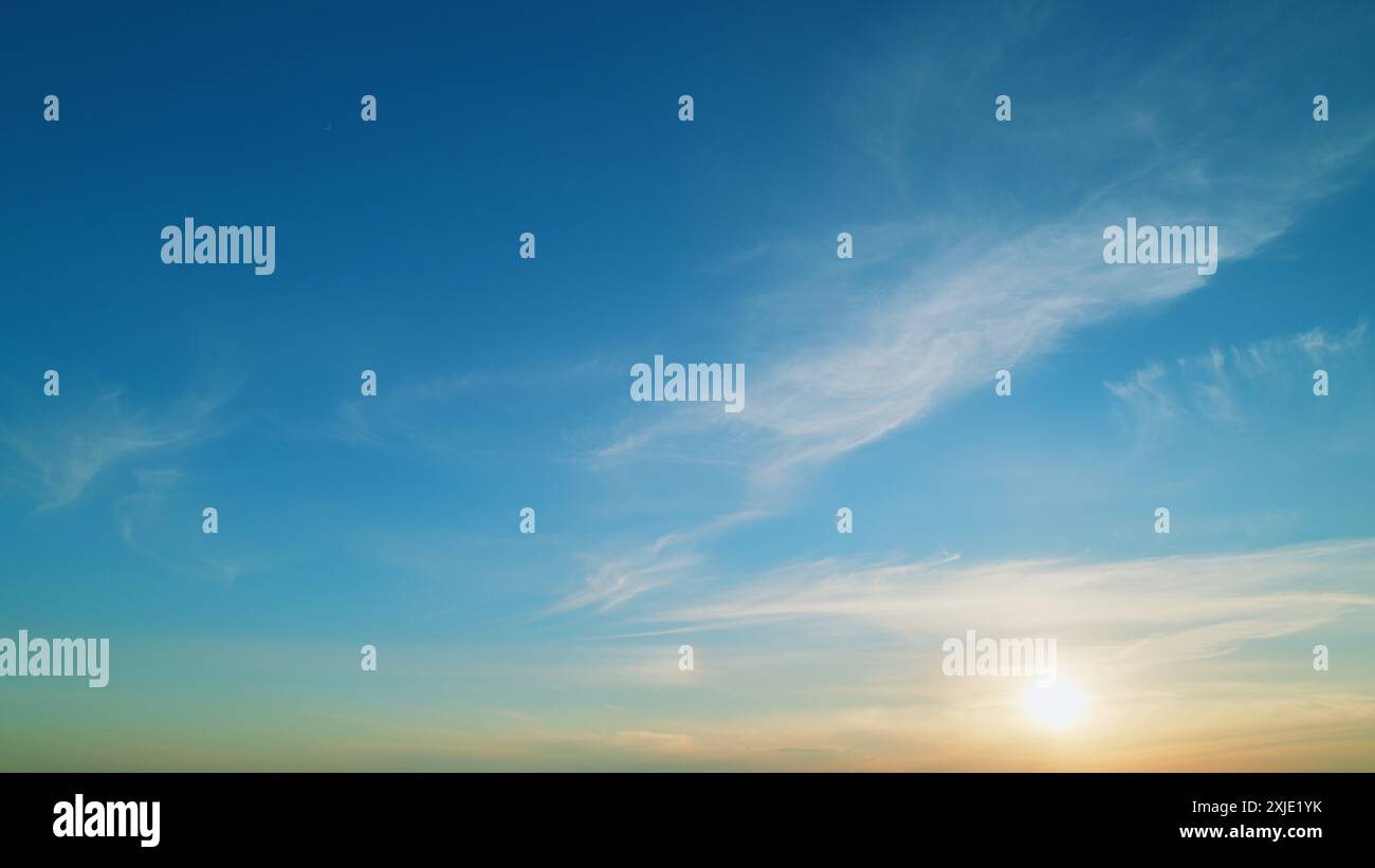 Time lapse. Dramatic cloudy sky with cloud. Orange clouds fly against ...