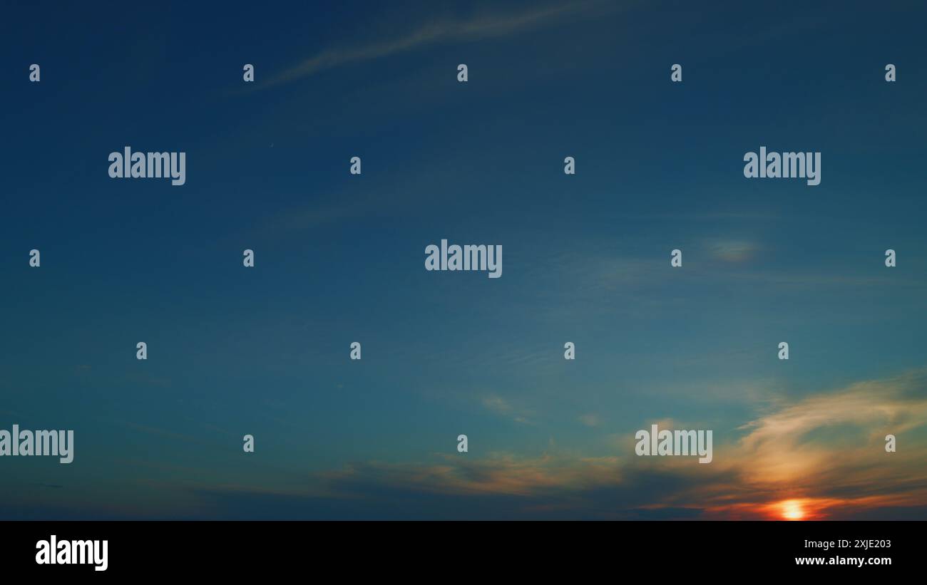 Time lapse. Rainbow sky clouds sunset with jet streams contrails ...