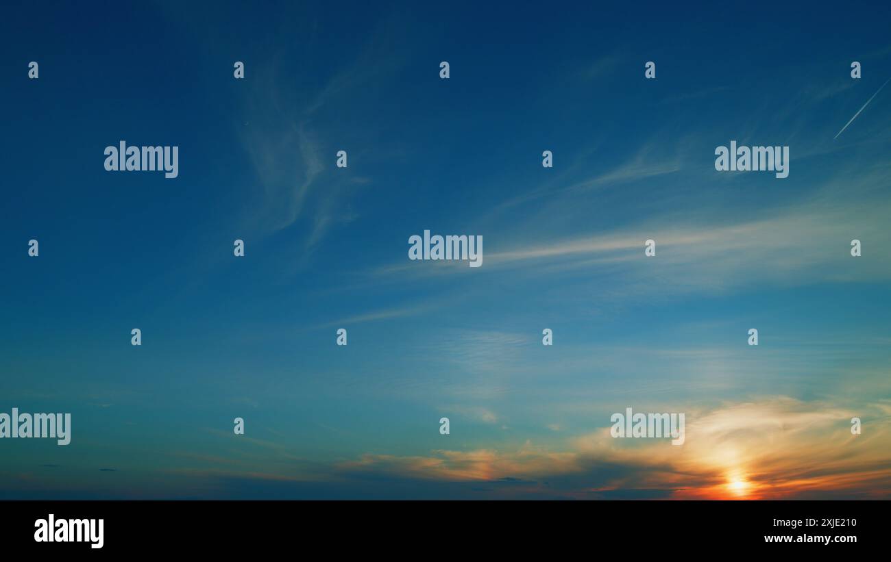 Time lapse. Jet plane airline fly high in sky with clouds leaving ...