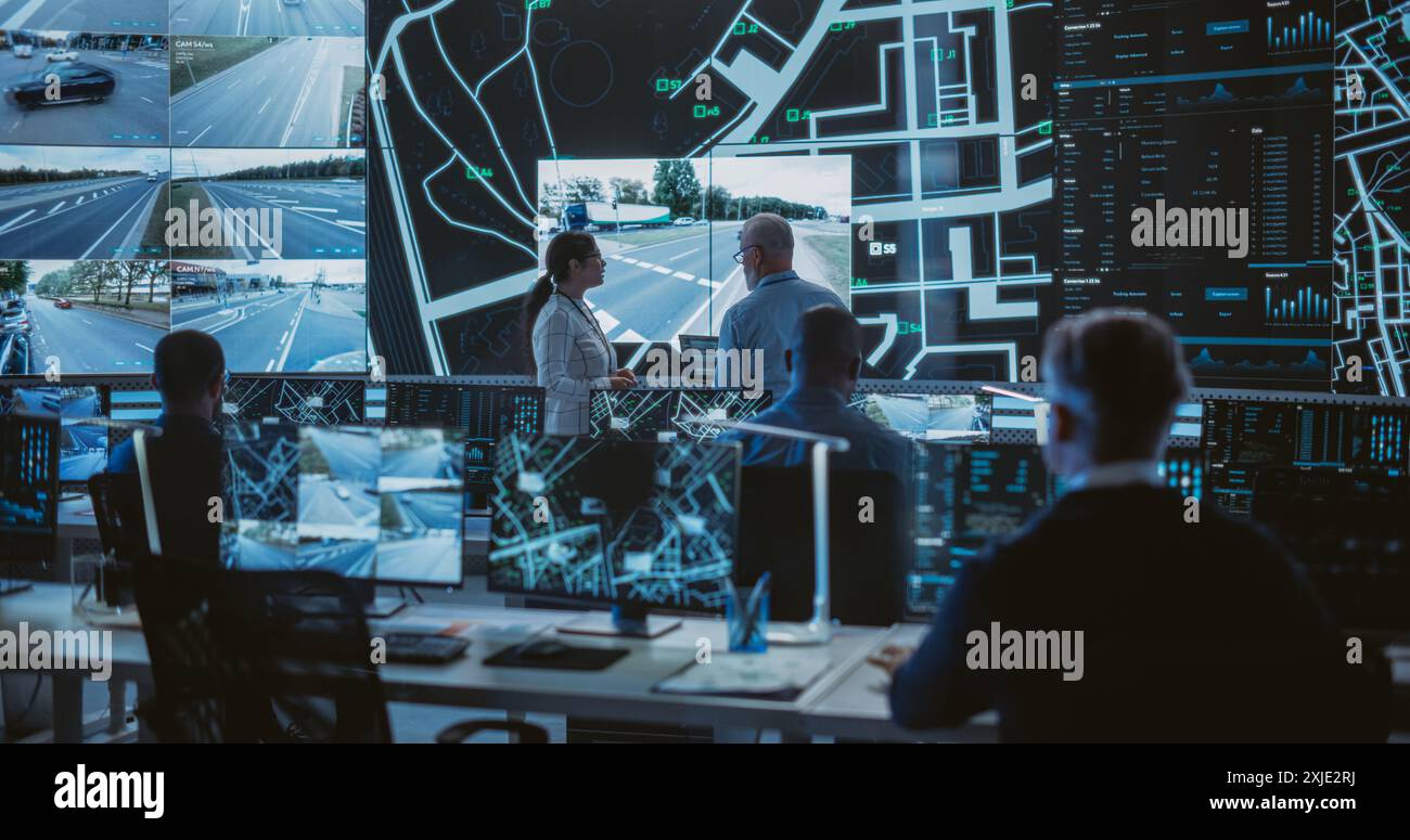 Futuristic City Logistics Planning Monitoring Center with Diverse Male ...