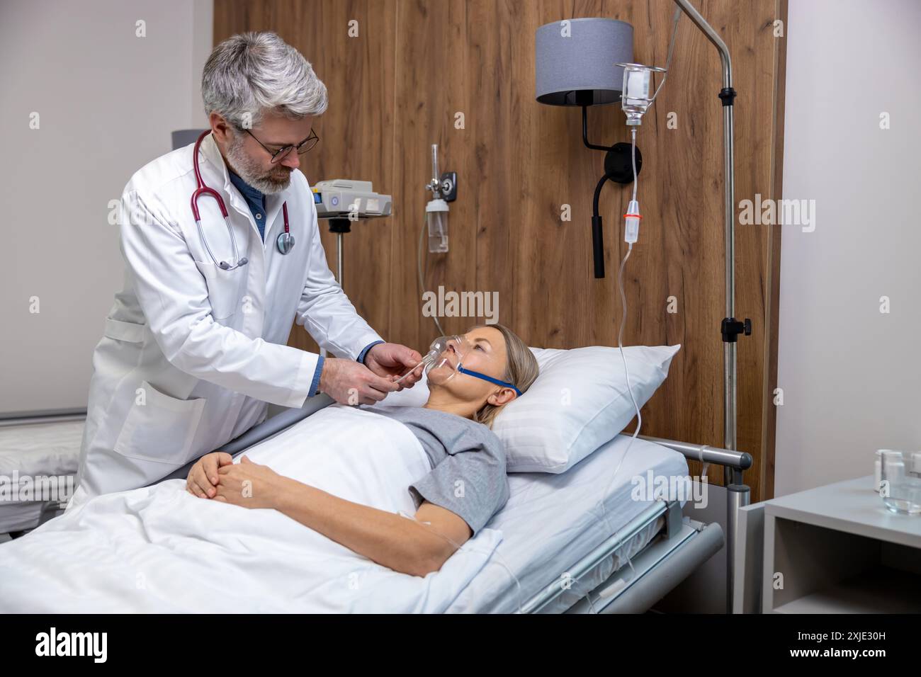 Female doctor fixing face hi-res stock photography and images - Alamy