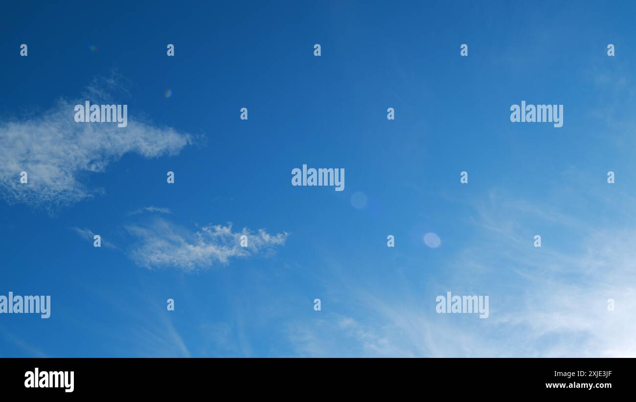 Time lapse. Beautiful big and fluffy clouds motion at sunny day in blue ...
