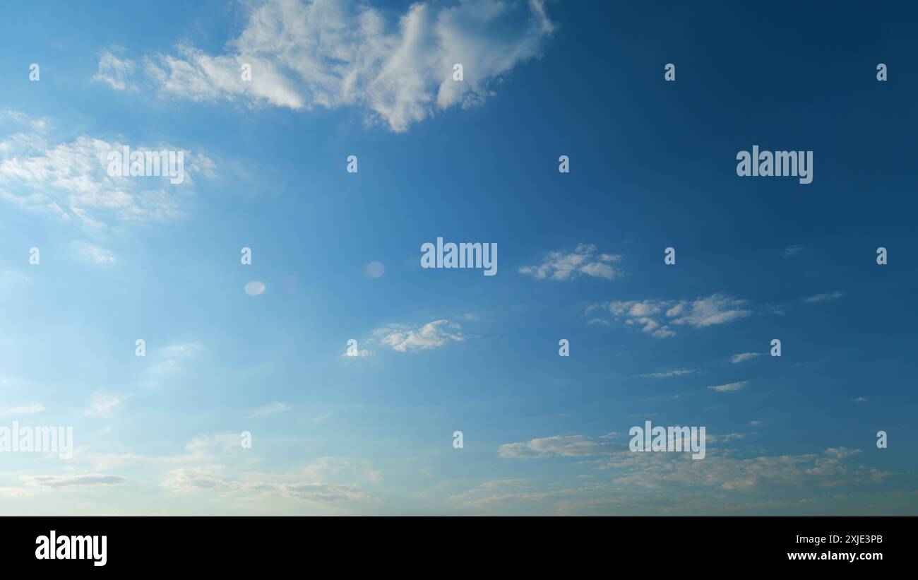 Time lapse. Soft white clouds. Clouds form against a dark blue sky ...