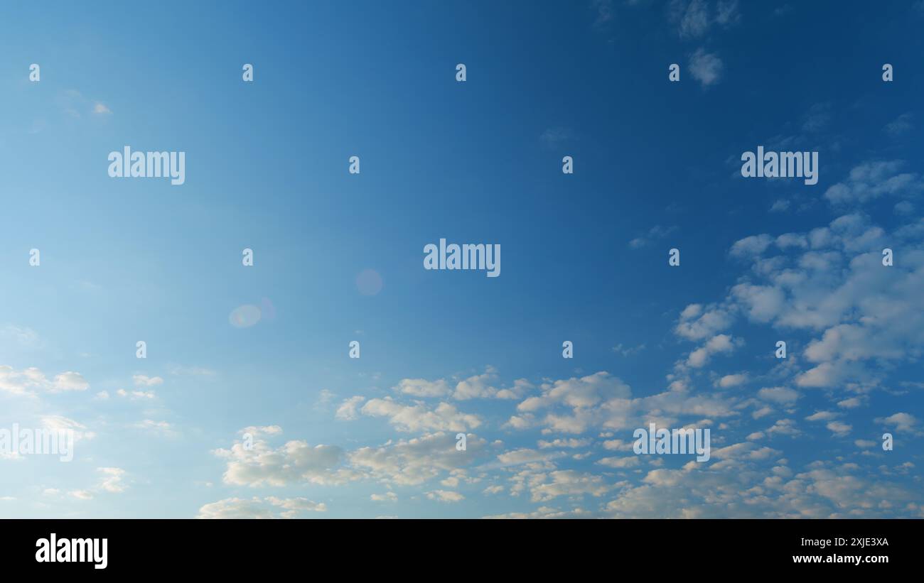 Time lapse. Clouds formation running across the blue sky. White puffy ...