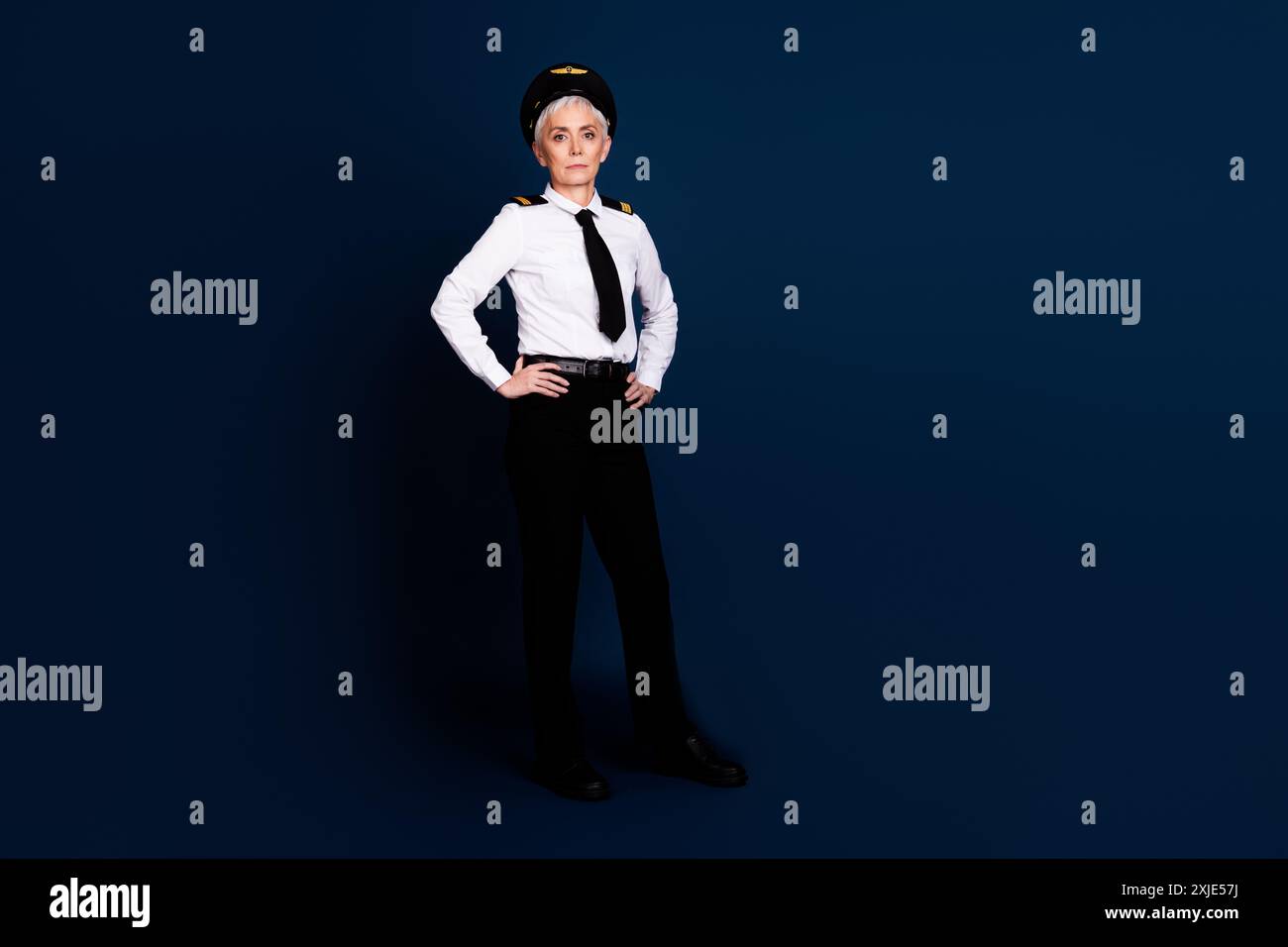 Full body photo of attractive senior woman passenger plane captain ...