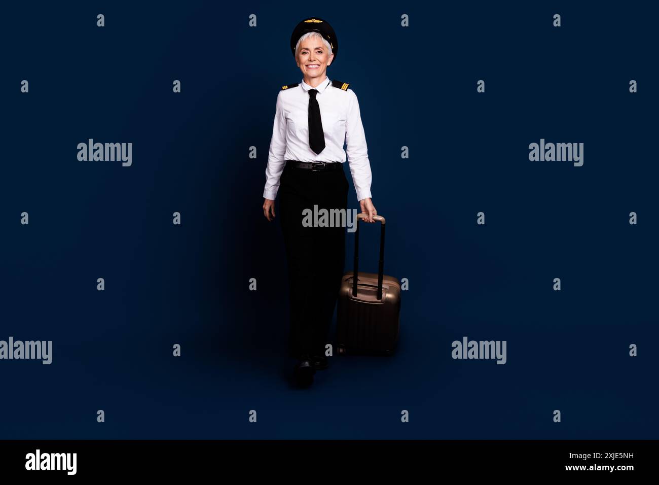 Full body photo of attractive senior woman passenger plane captain walk ...