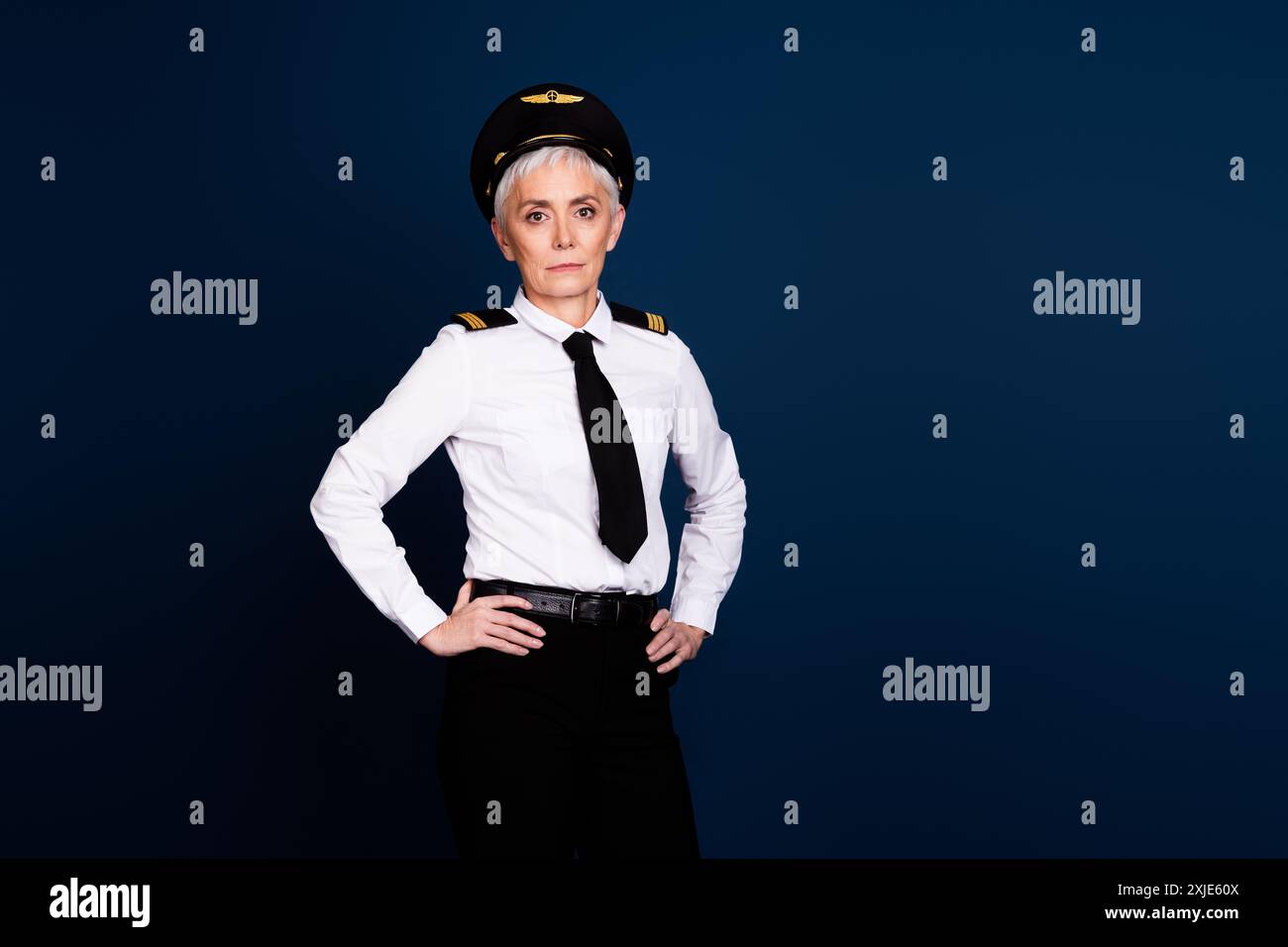 Photo portrait of pretty retired female professional airline pilot ...