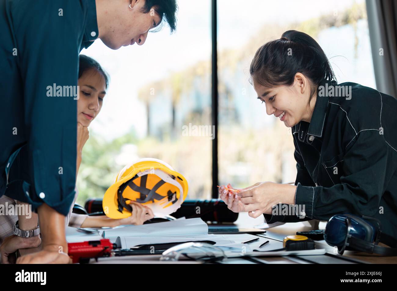 Group of Engineers Collaborating on a Project in a Modern Office ...