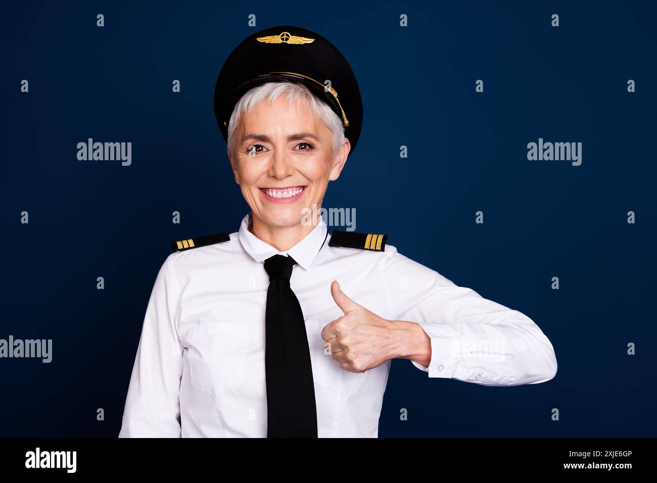 Photo of lovely pensioner lady professional commercial pilot thumb up ...