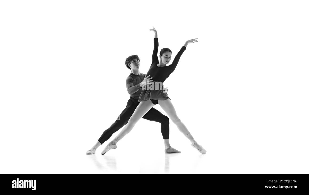 Ballet partners perfecting their form during practice session against ...