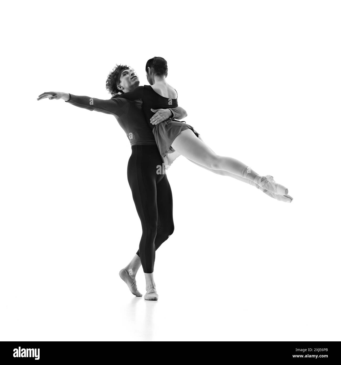 Graceful ballet partners practice their dance moves in motion against ...