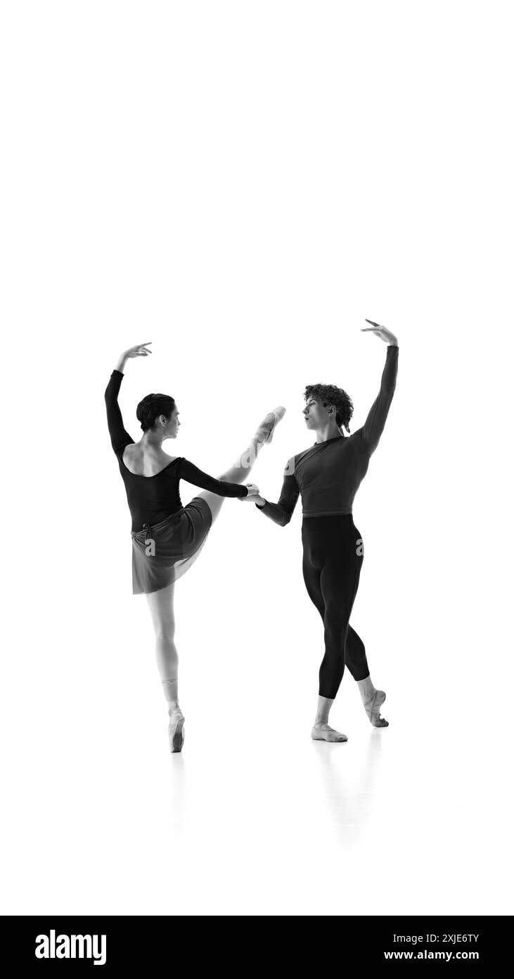 Elegance. Ballet duo harmonizes their movements during training against ...