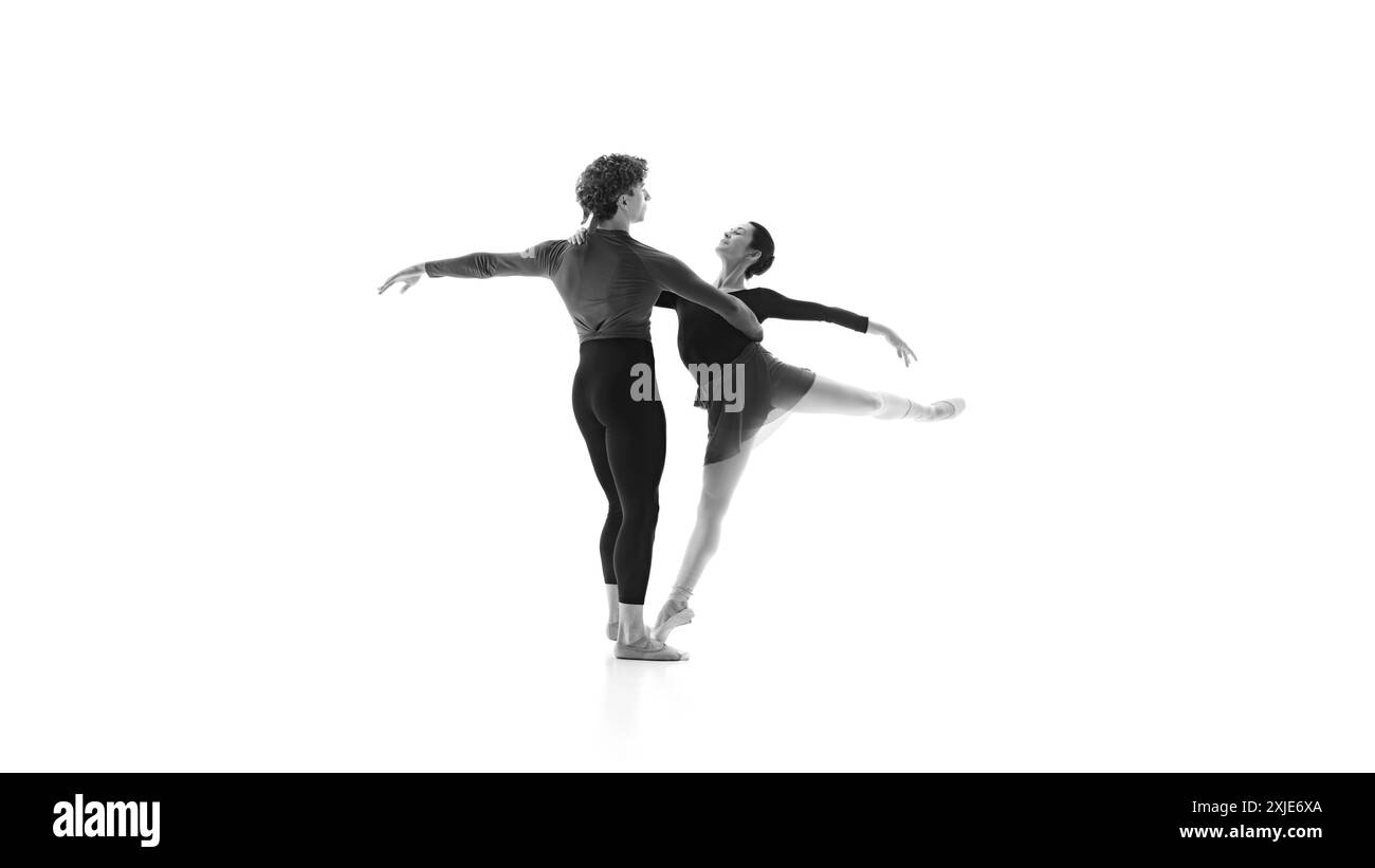 Ballet partners training their movements in practice against white ...