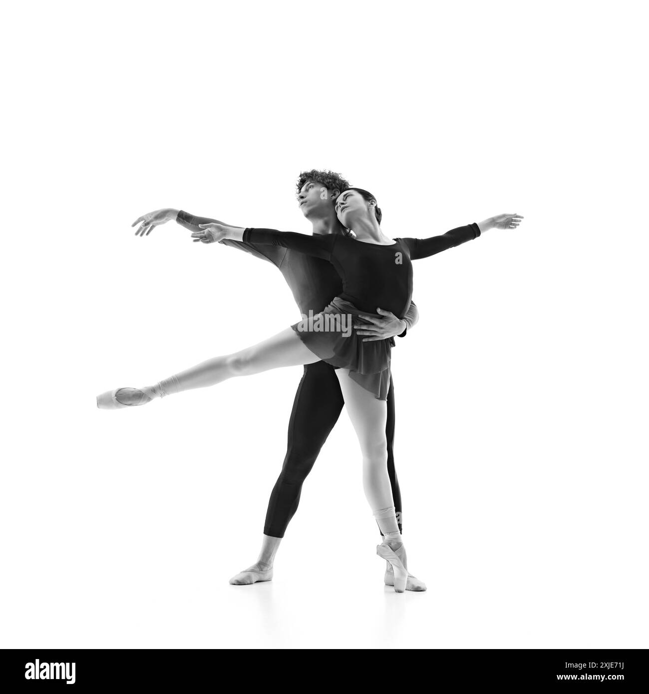 Grace and elegance. Young ballet dancers training in motion against ...