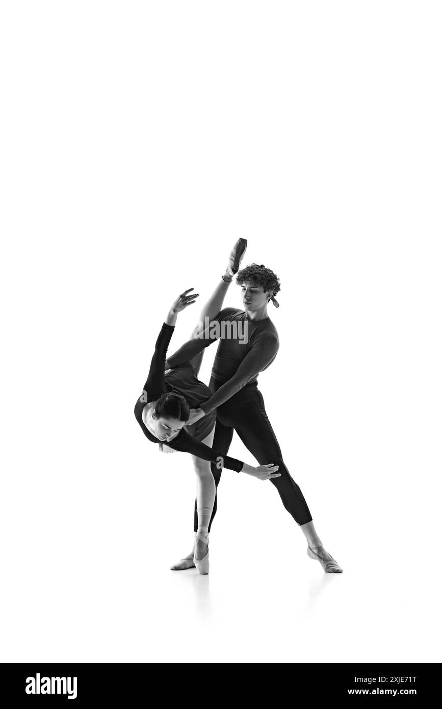 Ballet duo, graceful man and woman, perfecting dynamic bend against ...