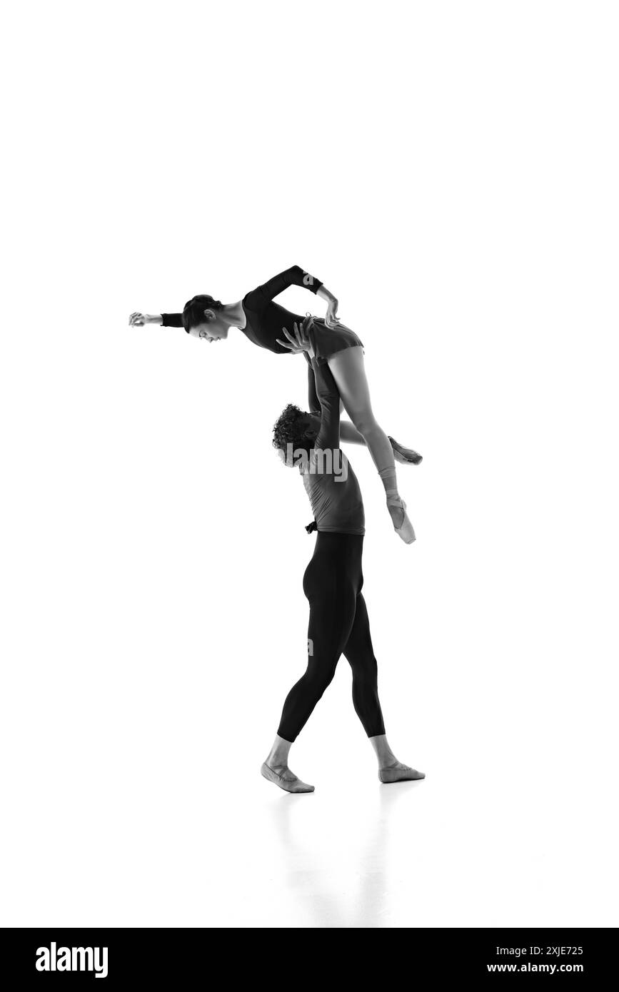 Artistic dancer dedicated to perfecting their ballet against white ...