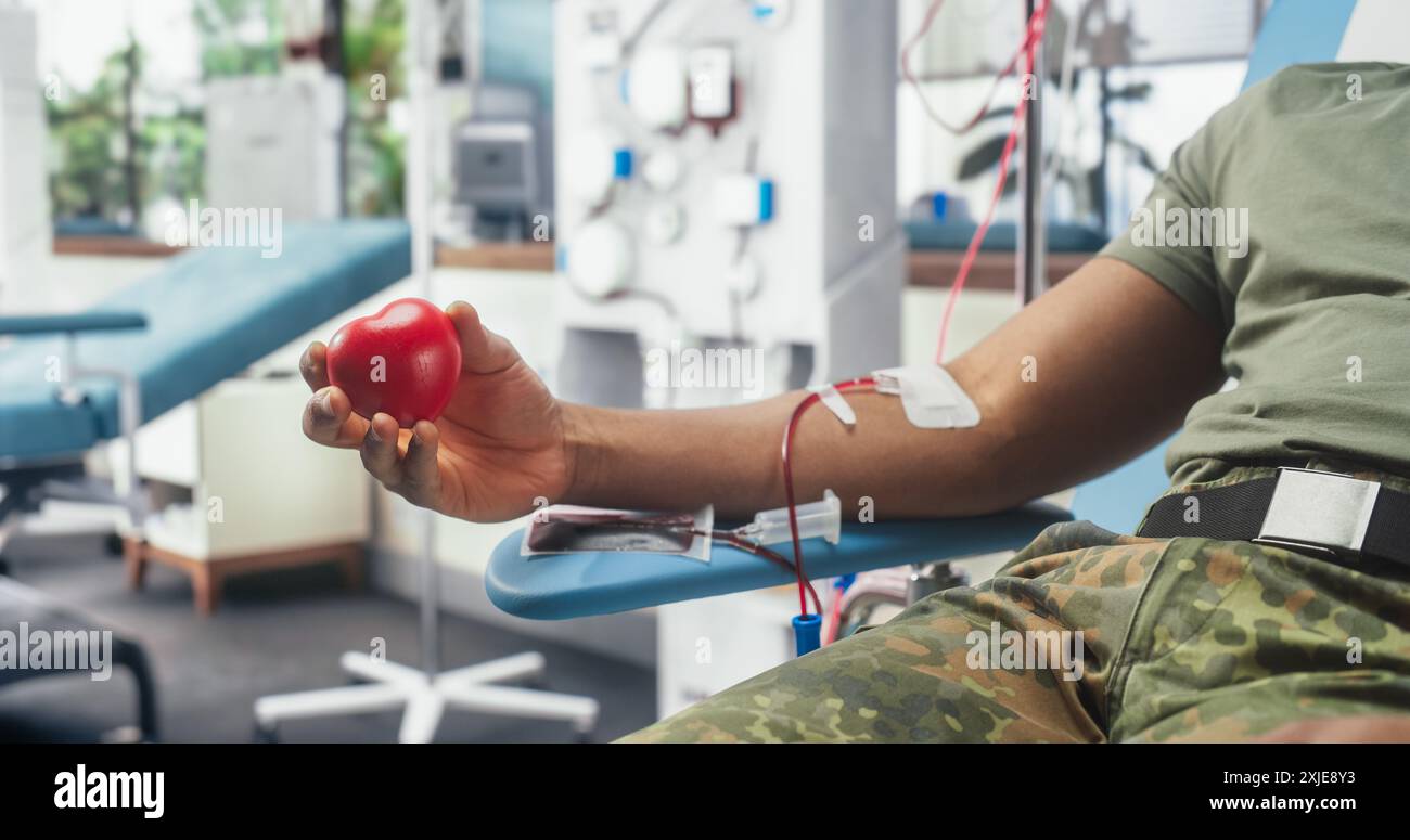 Close Up Of Hand Of Black Army Soldier With Attached Catheter In ...