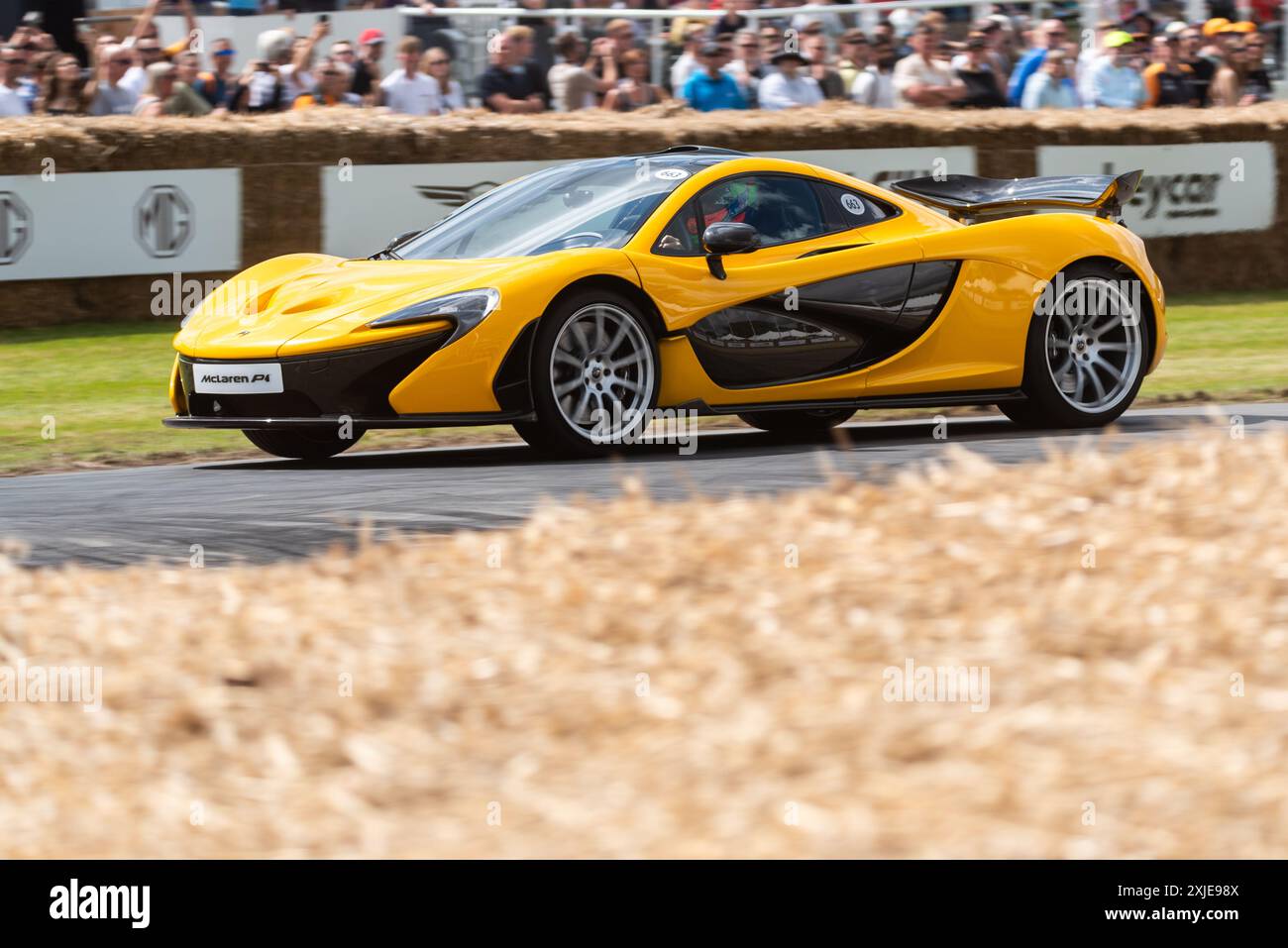 2017 McLaren P1 hybrid sports car driving up the hill climb track at ...
