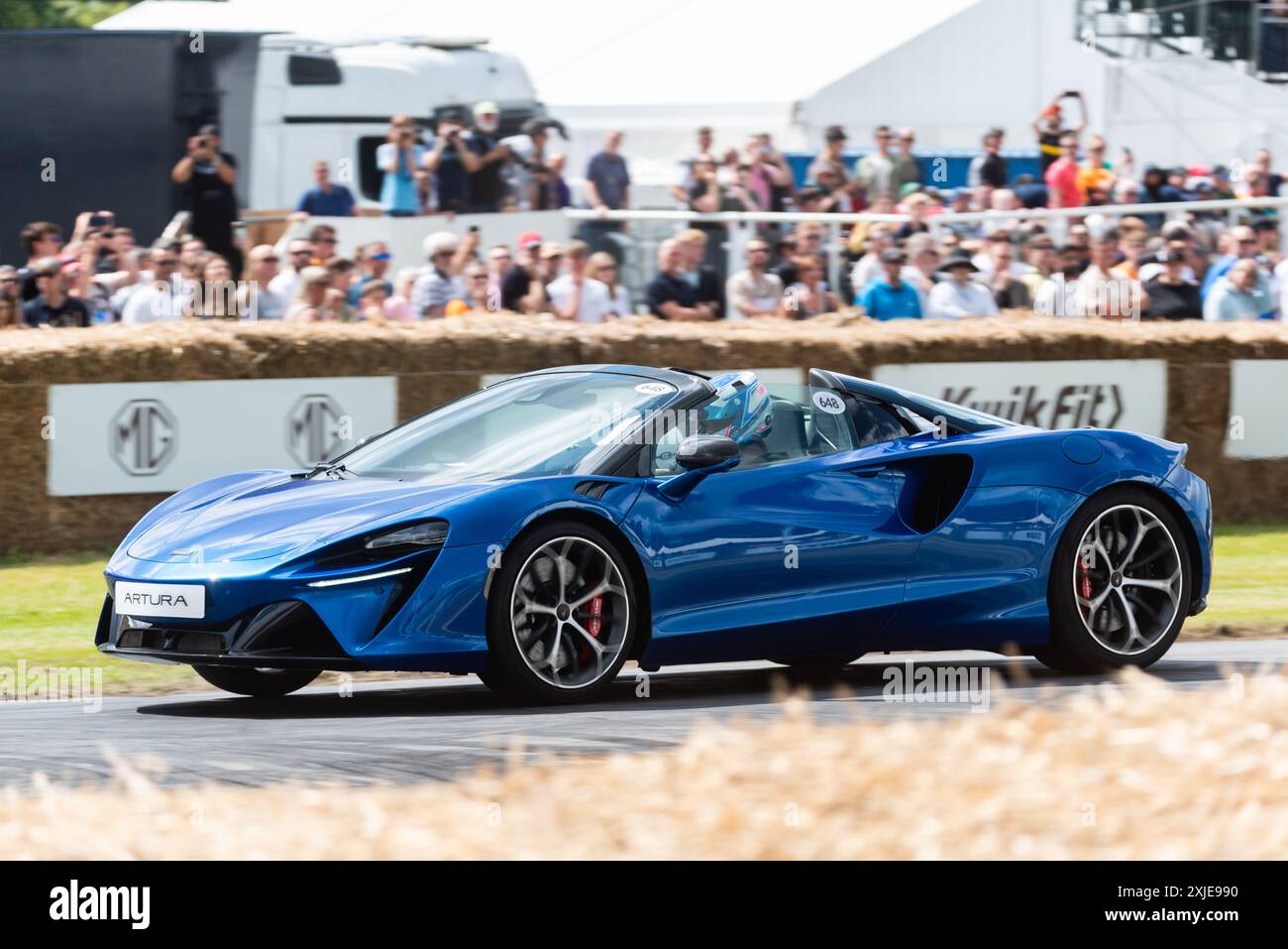 2024 McLaren Artura Spider hybrid sports car driving up the hill climb ...