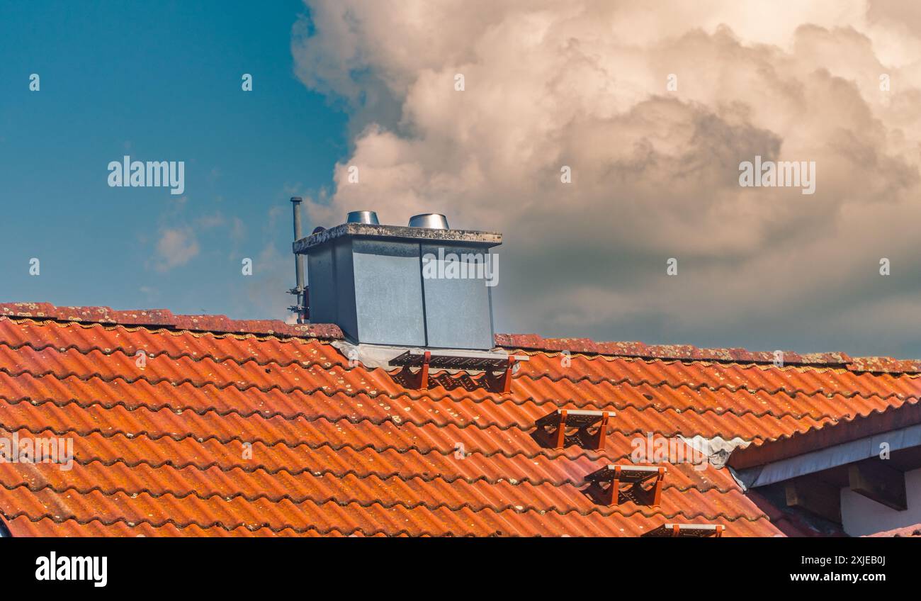 Roof ventilation chimney. Air filters. Metal structure. Gable roof with ...